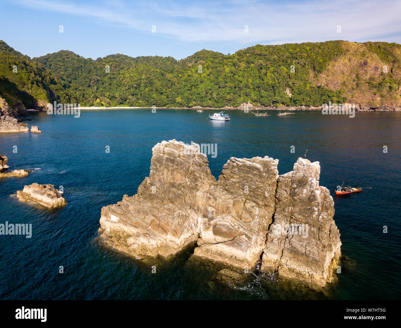 A SCUBA diving boat moored off a beautiful tropical island in the ...