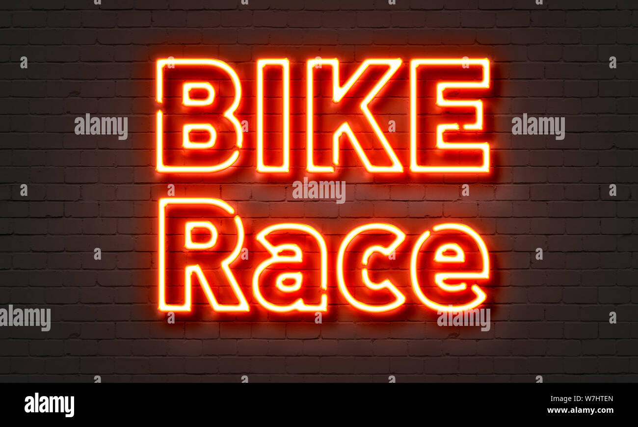 Bike race neon sign on brick wall background Stock Photo - Alamy