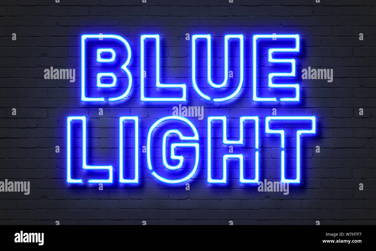 Blue light neon sign on brick wall background Stock Photo - Alamy