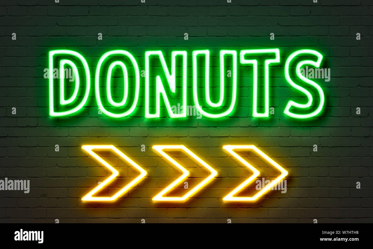 Donuts neon sign green Stock Photo - Alamy