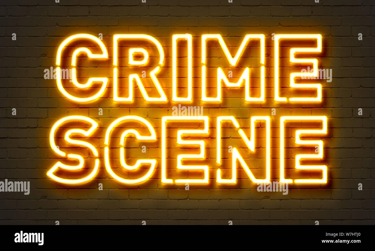 Crime scene neon sign on brick wall background Stock Photo - Alamy