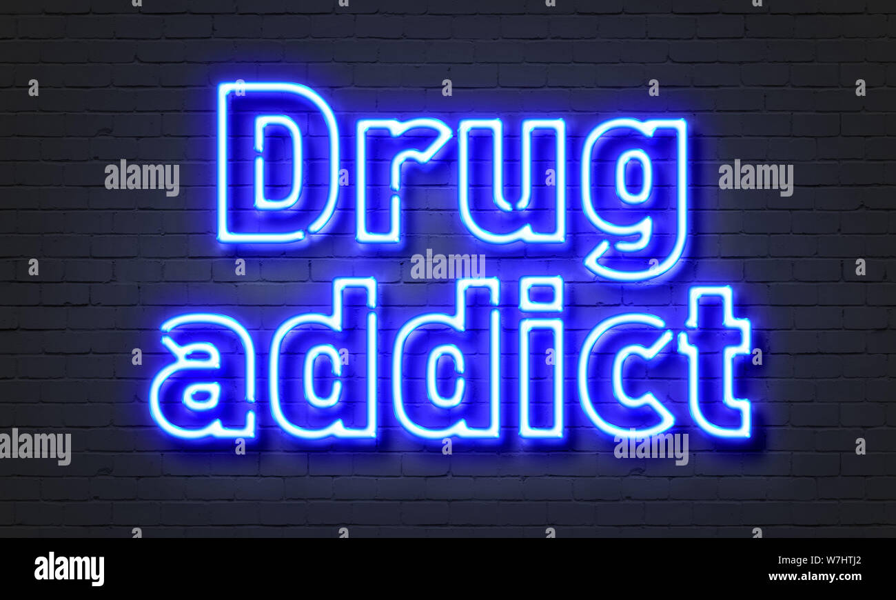 Drug addict neon sign on brick wall background Stock Photo - Alamy