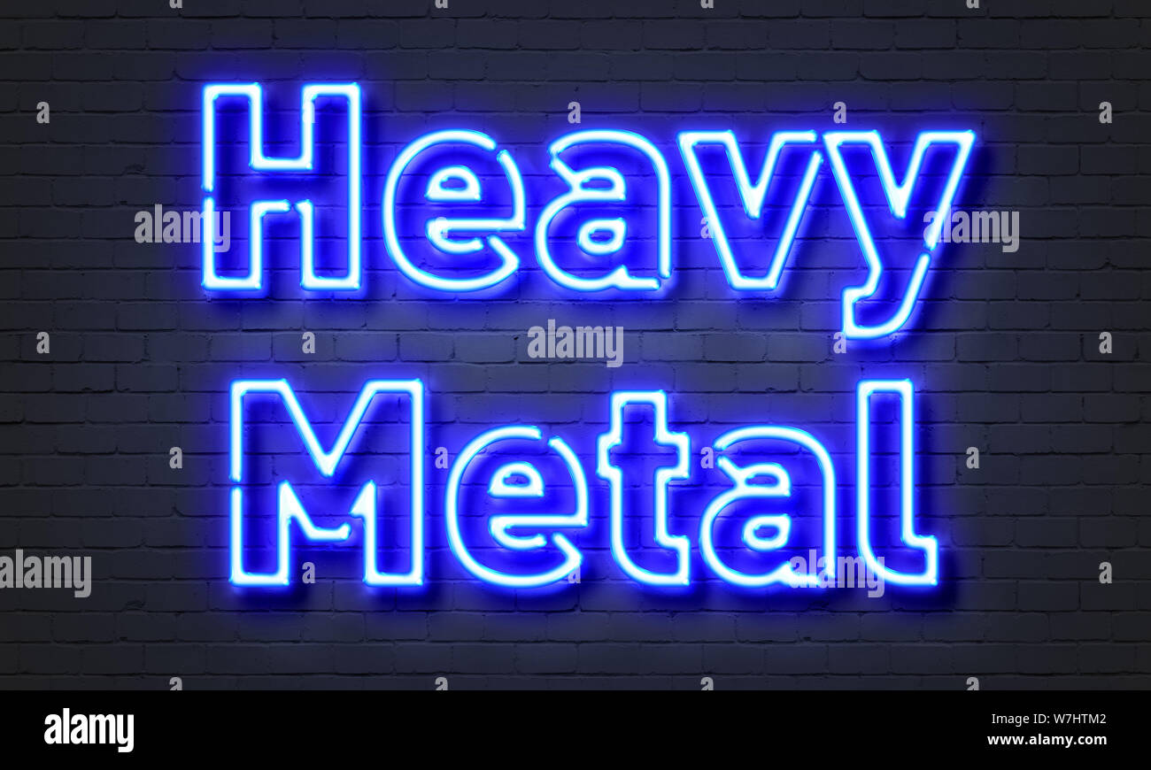 Heavy metal neon sign on brick wall background Stock Photo - Alamy