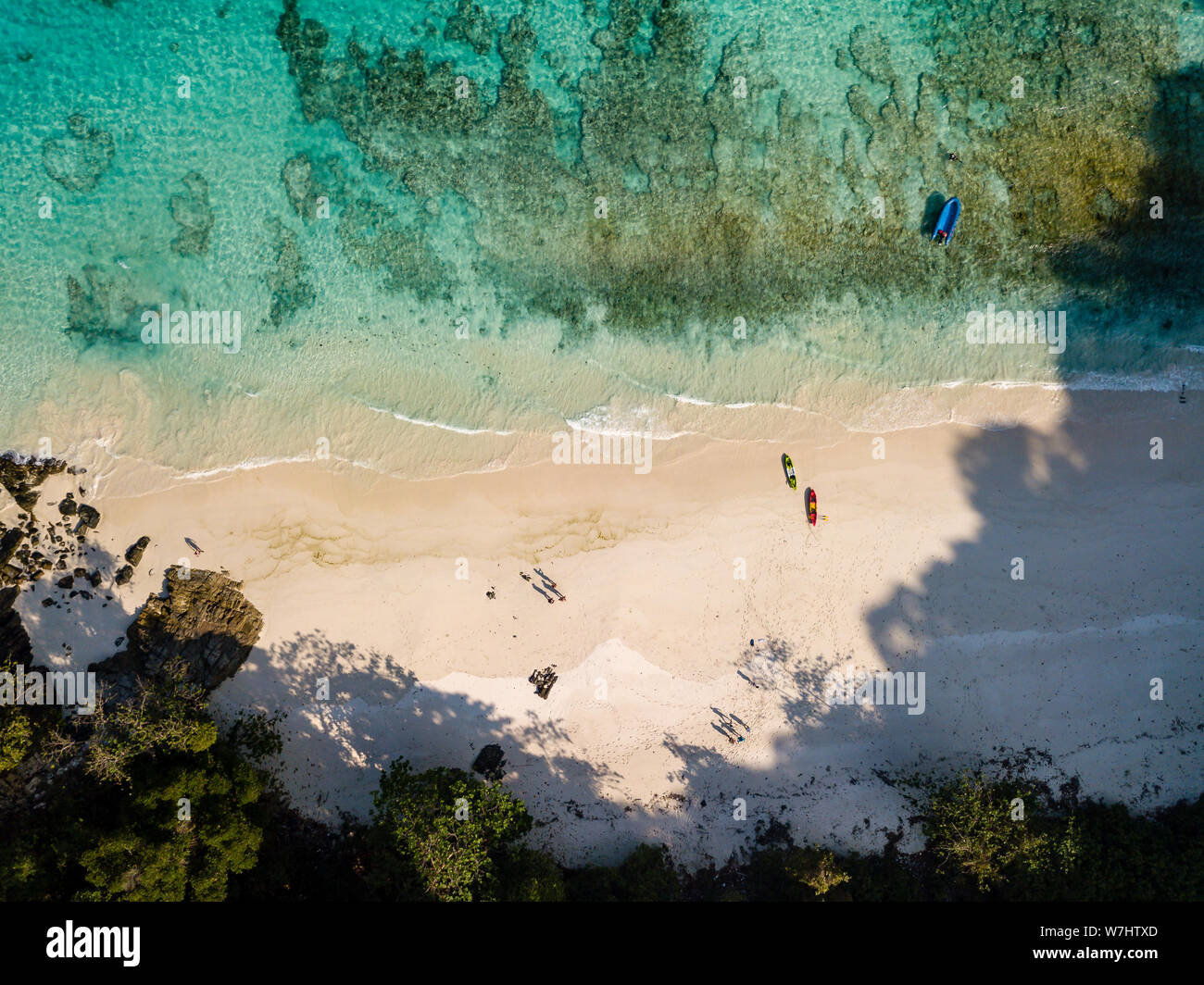 Aerial drone view of tourists and kayaks on a beautiful, unspoilt ...
