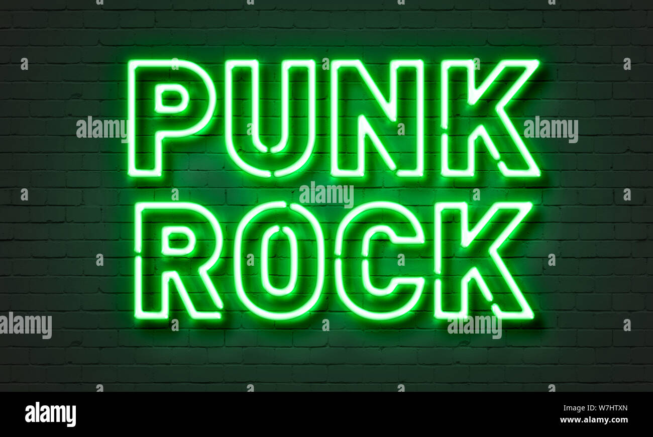 Punk rock neon sign on brick wall background Stock Photo - Alamy