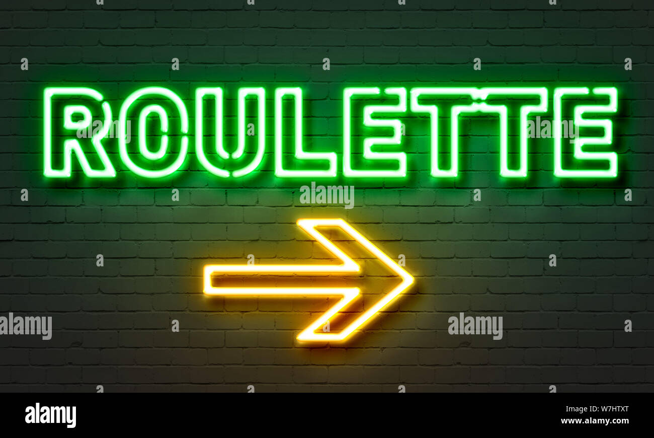 Roulette neon sign on brick wall background Stock Photo - Alamy