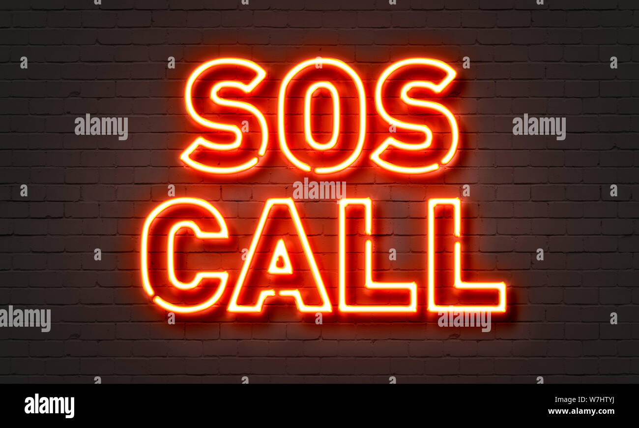 SOS call neon sign on brick wall background Stock Photo - Alamy