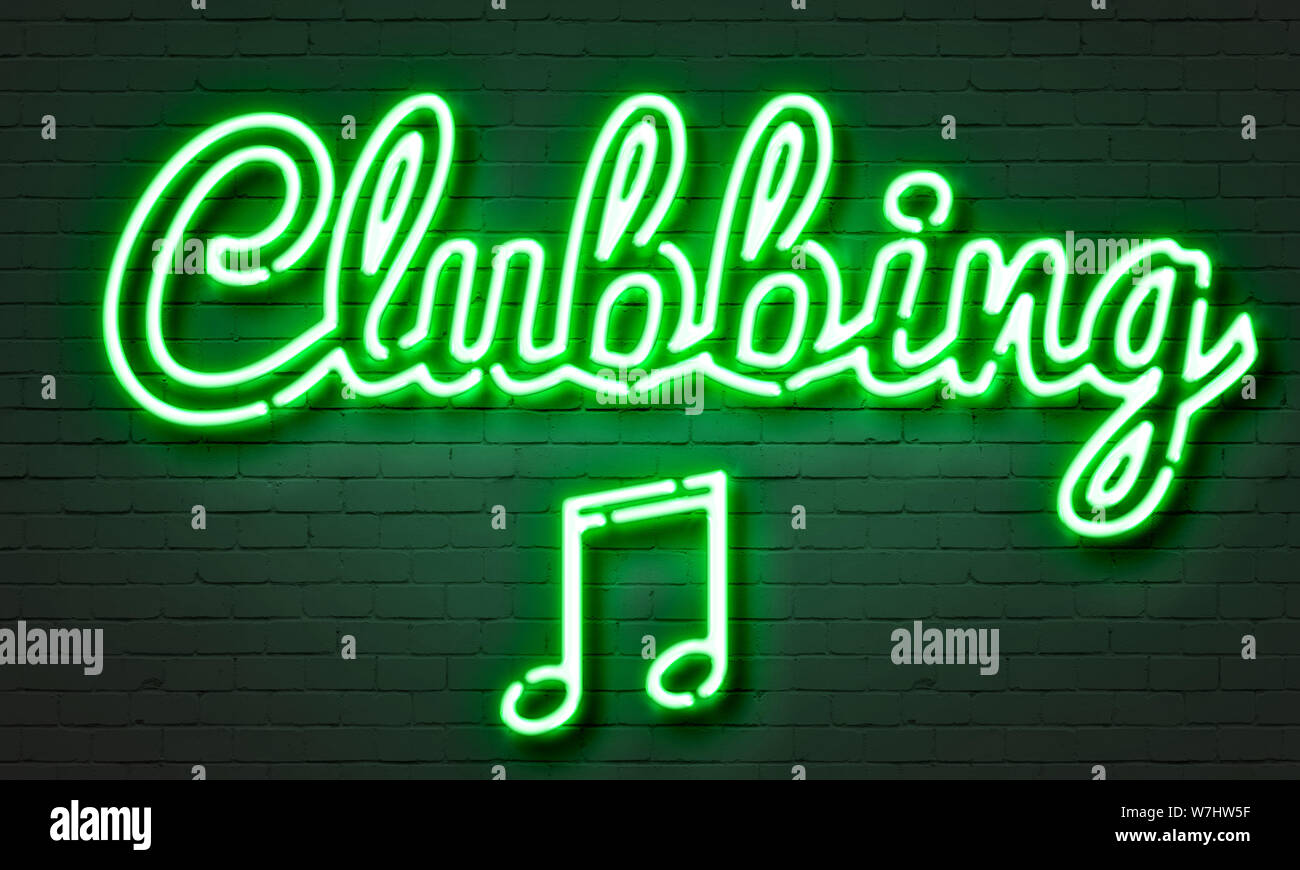 Clubbing neon sign on brick wall background Stock Photo - Alamy