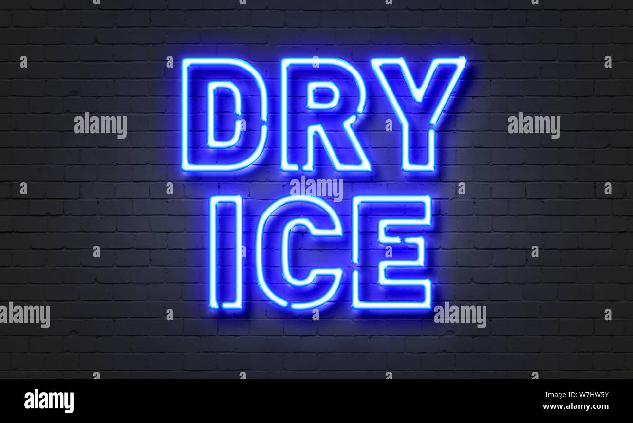 Dry ice neon sign on brick wall background Stock Photo - Alamy