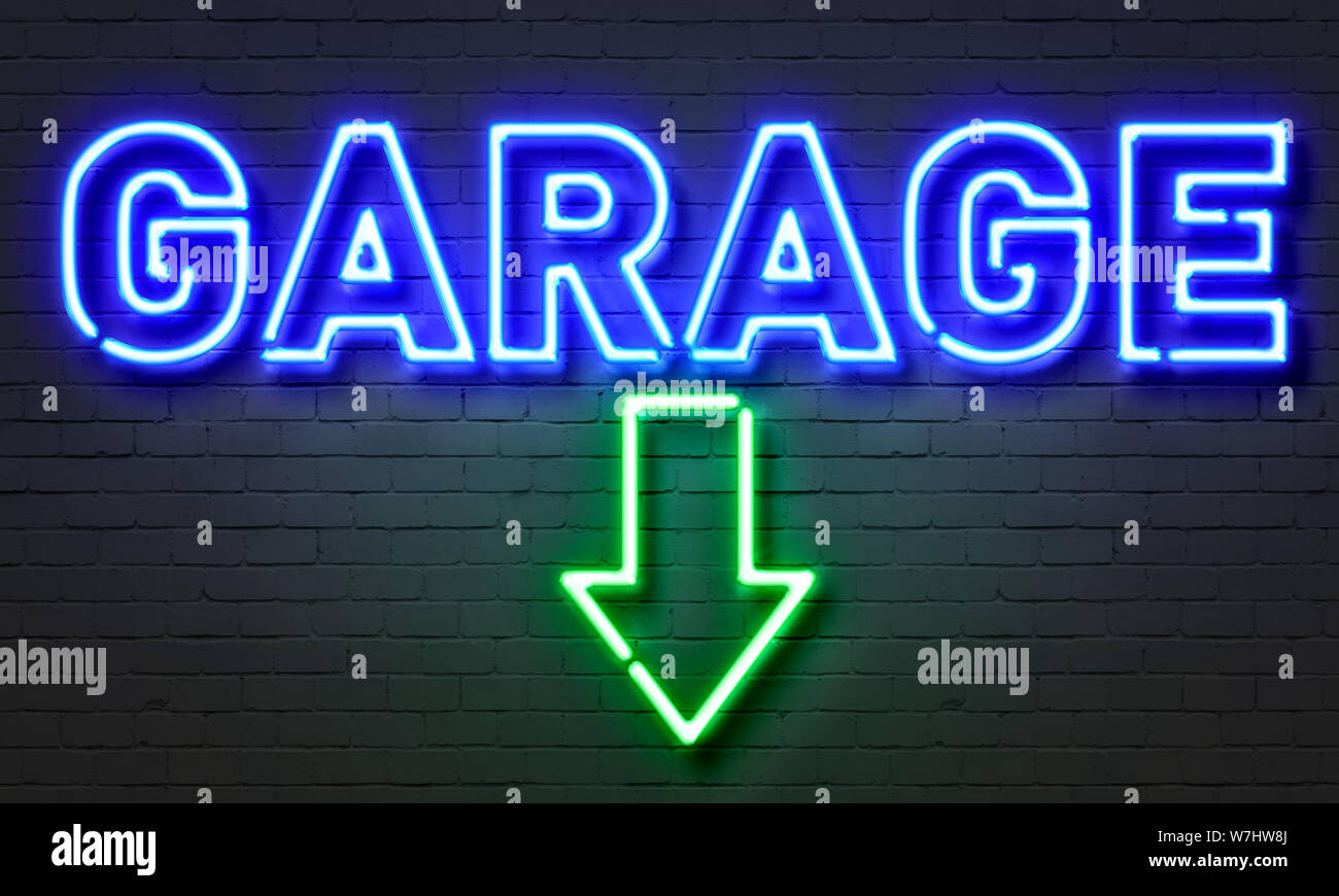 Garage neon sign on brick wall background Stock Photo - Alamy