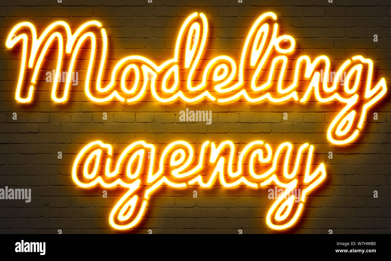 Modeling agency neon sign on brick wall background Stock Photo - Alamy
