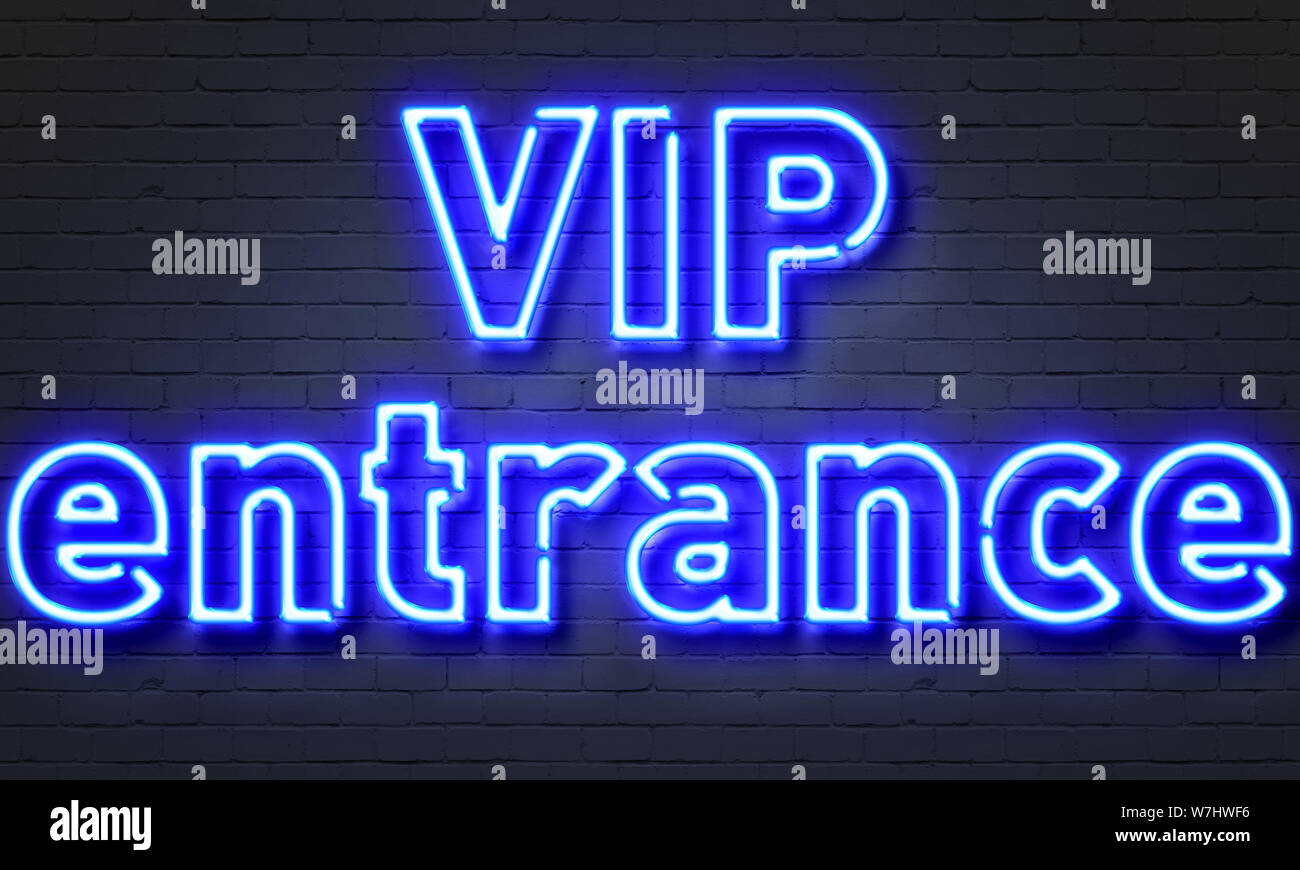 VIP entrance neon sign on brick wall background Stock Photo - Alamy