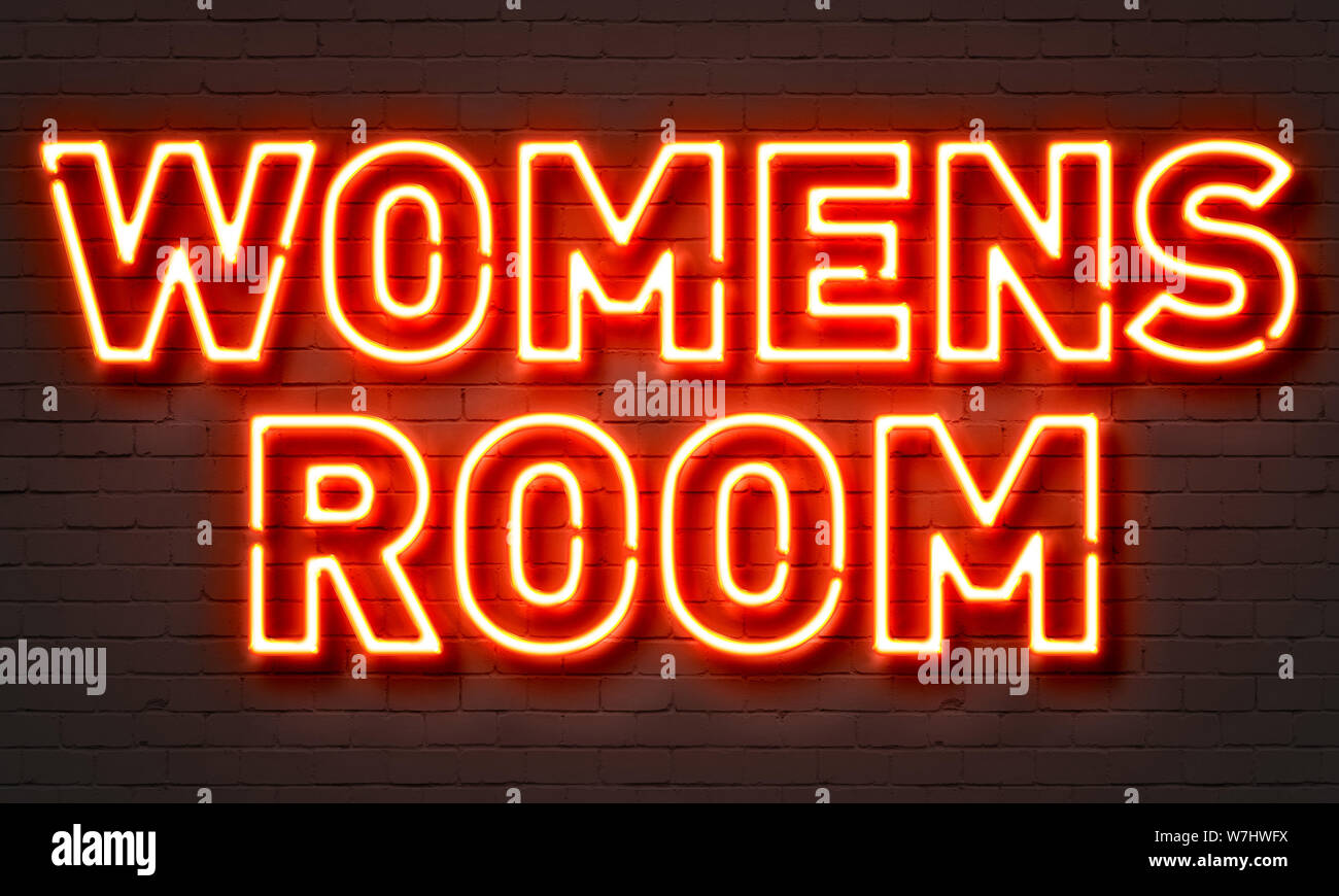 Womens room neon sign on brick wall background Stock Photo - Alamy