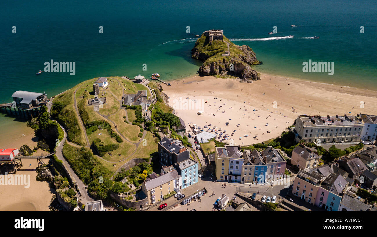 Aerial drone view of colorful buildings next to the ocean in a ...