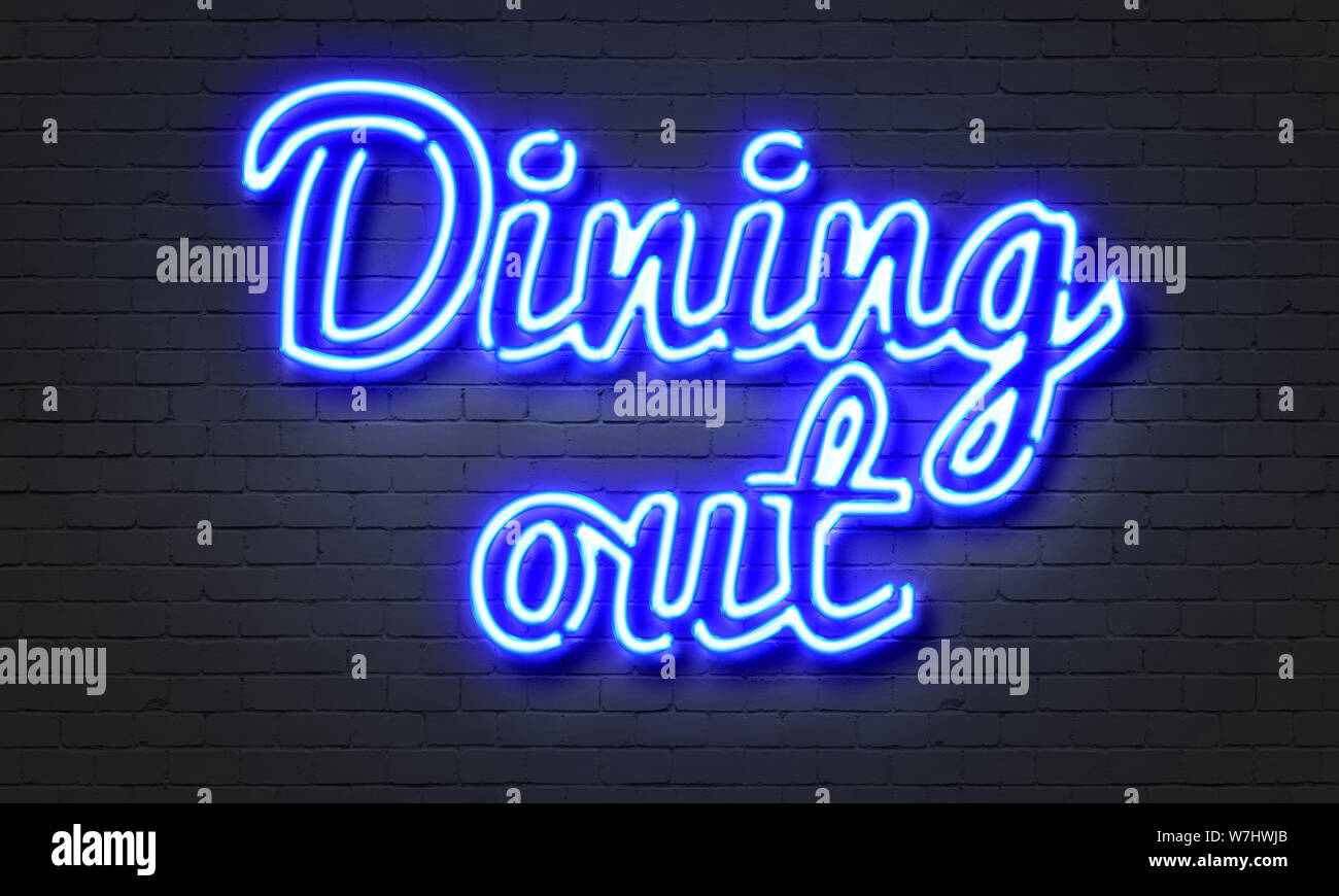 Dining out neon sign on brick wall background Stock Photo - Alamy