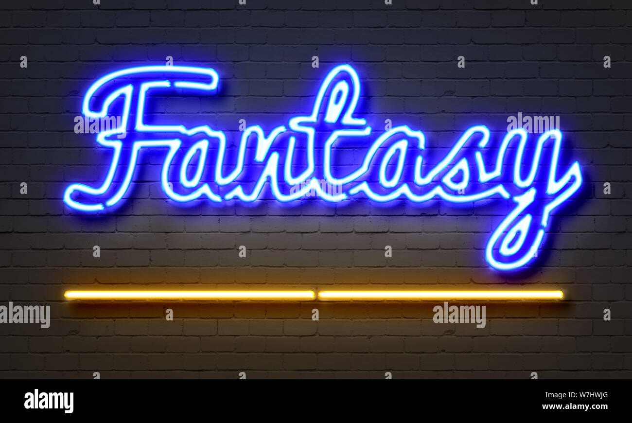 Fantasy neon sign on brick wall background Stock Photo - Alamy