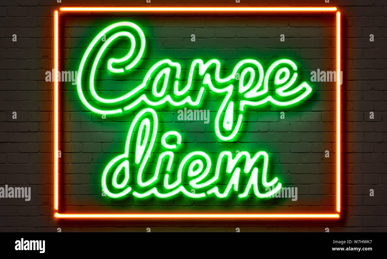 Carpe diem neon sign on brick wall background Stock Photo - Alamy