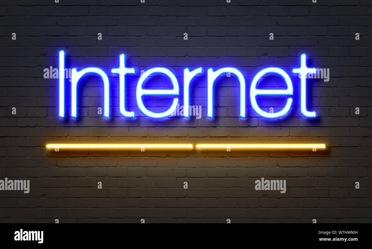 Internet neon sign on brick wall background Stock Photo - Alamy