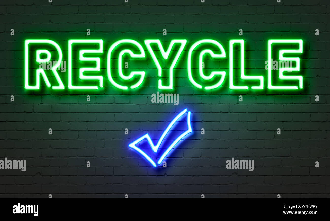 Recycle neon sign on brick wall background Stock Photo - Alamy