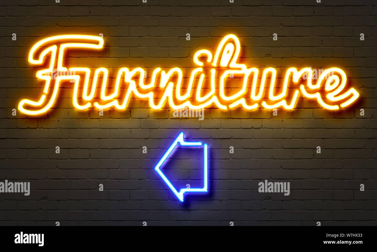 Furniture neon sign on brick wall background Stock Photo - Alamy