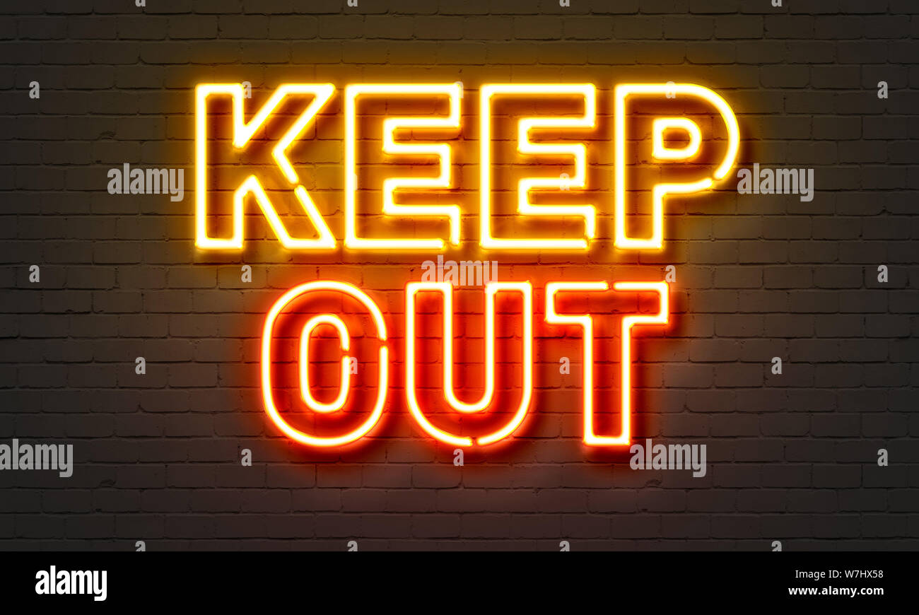Keep out neon sign on brick wall background Stock Photo - Alamy
