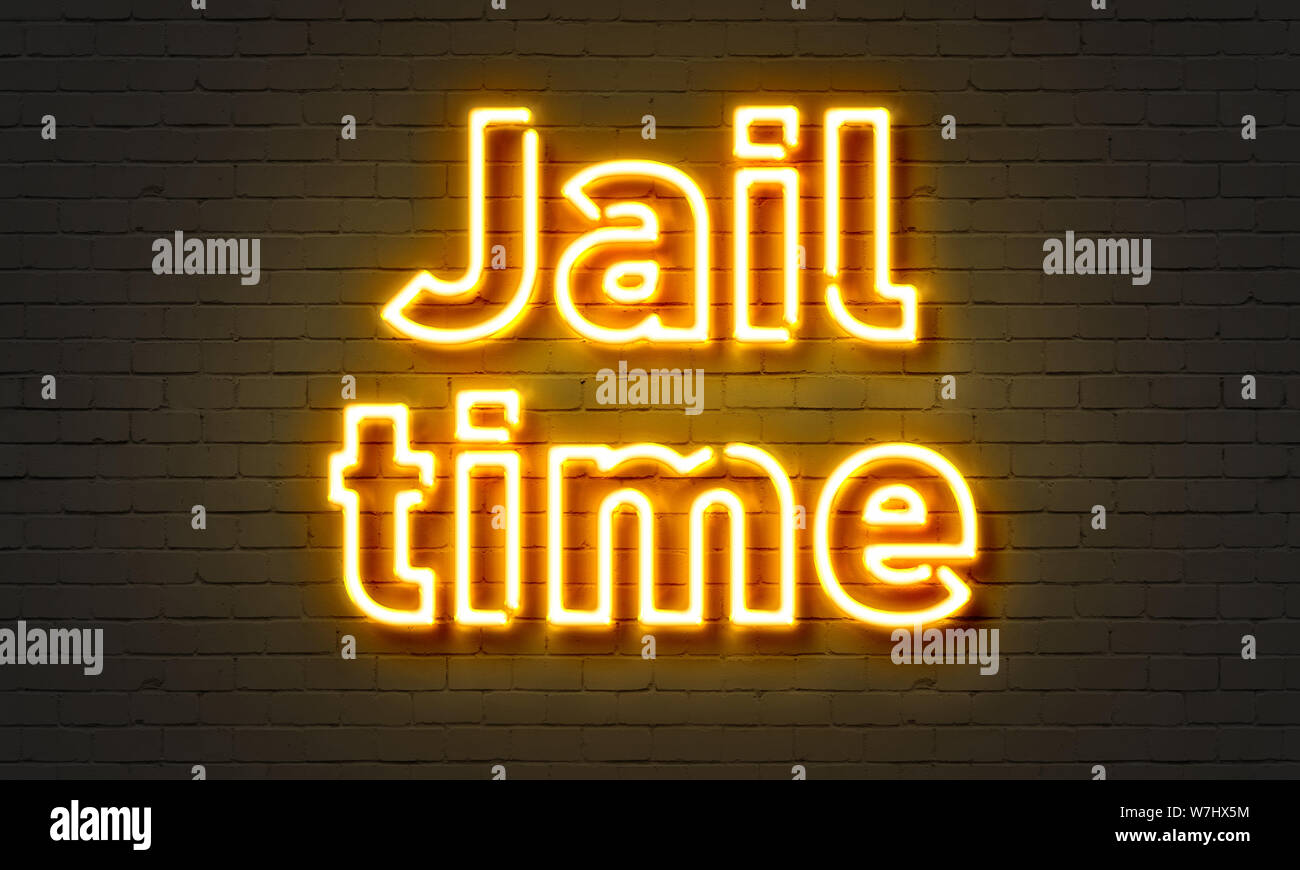 Jail time neon sign on brick wall background Stock Photo - Alamy