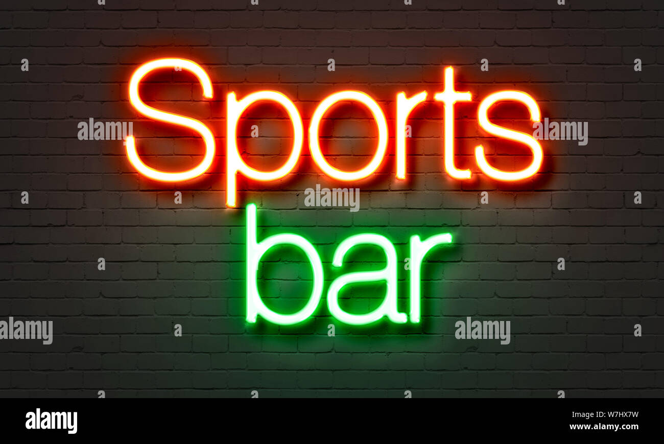 Sports bar neon sign on brick wall background Stock Photo - Alamy