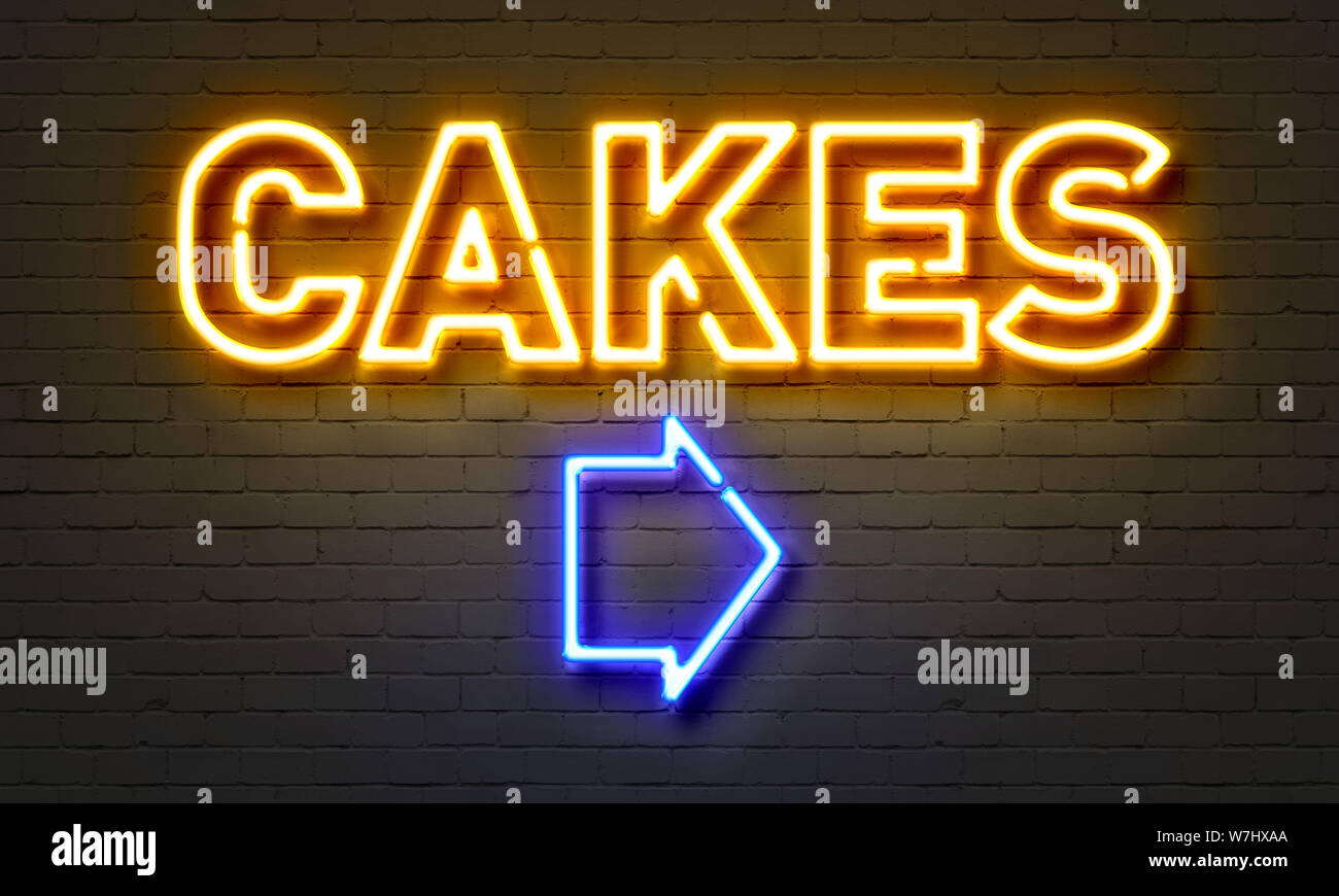 Cakes neon sign on brick wall background Stock Photo - Alamy