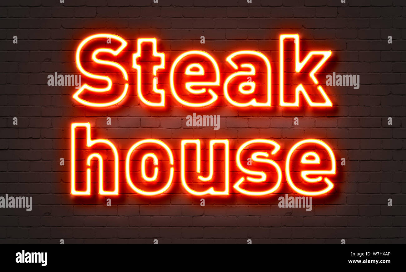 Steak house neon sign on brick wall background Stock Photo - Alamy