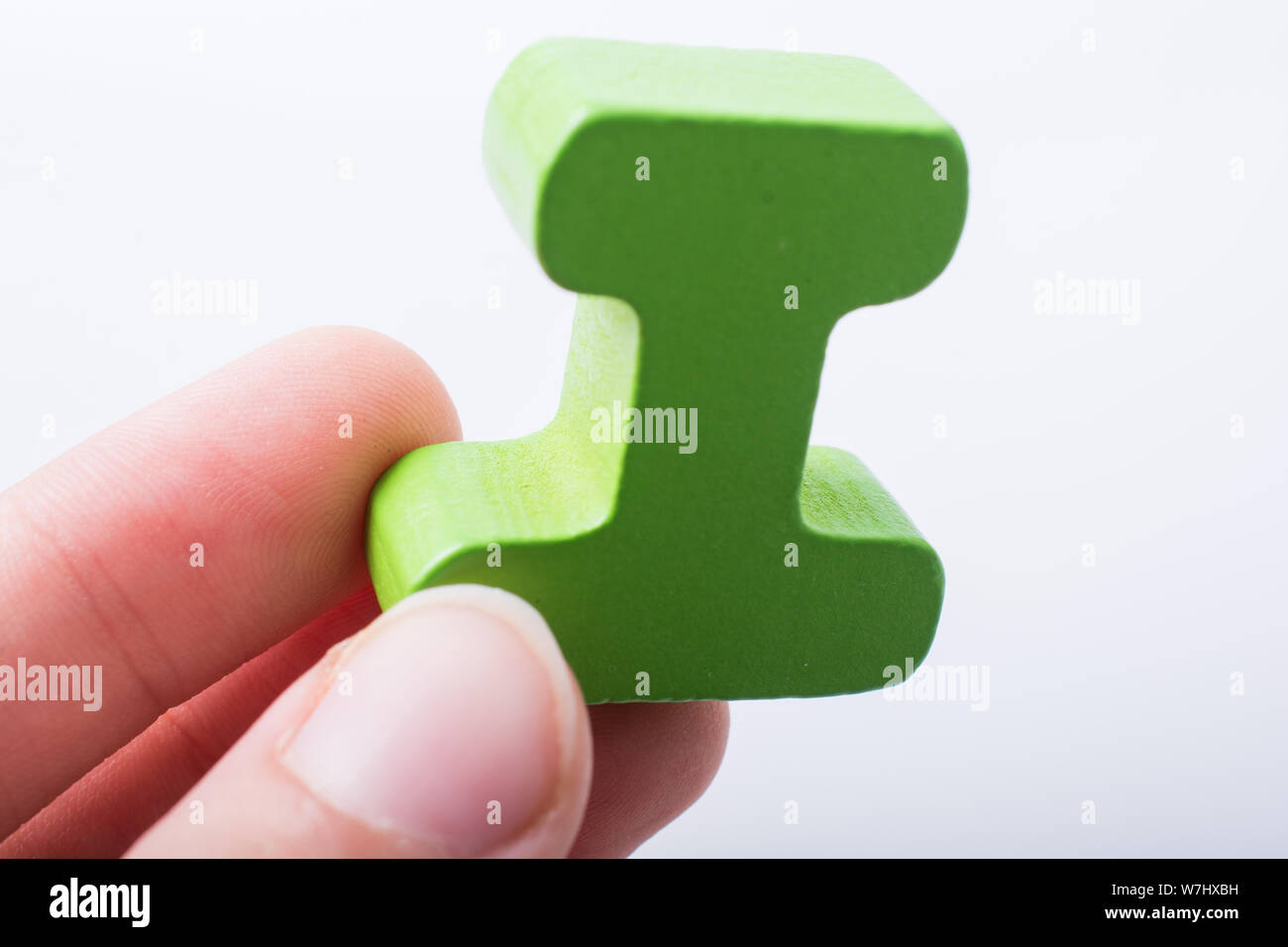 Hand holding Letter cube of I of Alphabet Stock Photo - Alamy