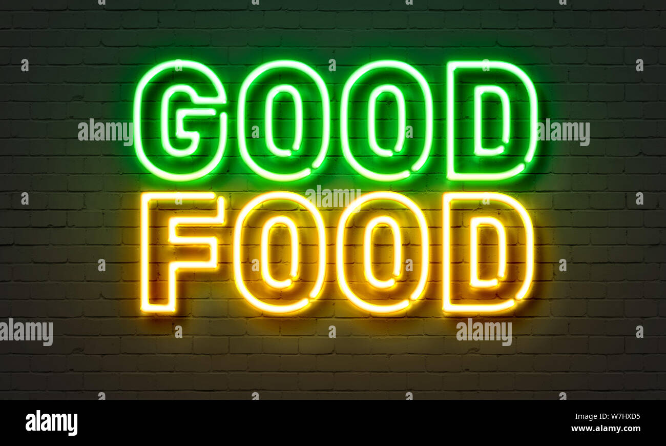Good food neon sign on brick wall background Stock Photo - Alamy
