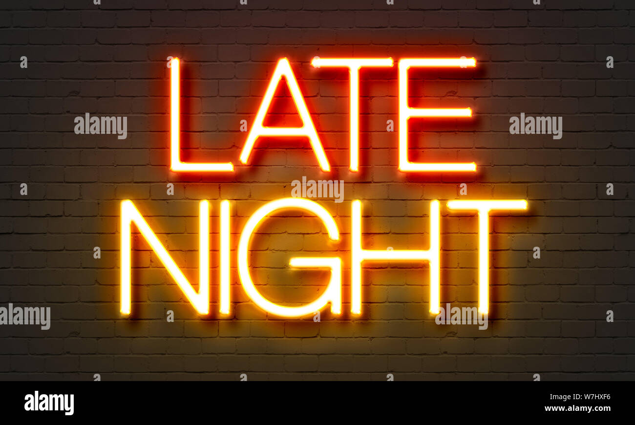 Late night neon sign on brick wall background Stock Photo - Alamy