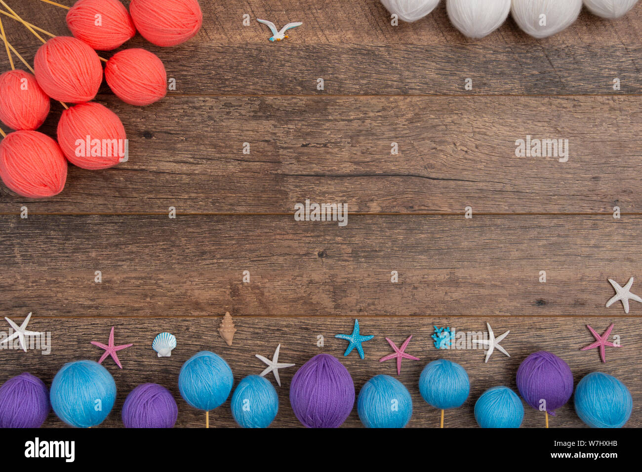 Sea stars, shell and coral with yarn balls Stock Photo - Alamy