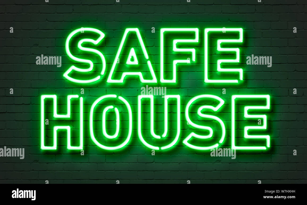 Safe house neon sign on brick wall background Stock Photo - Alamy
