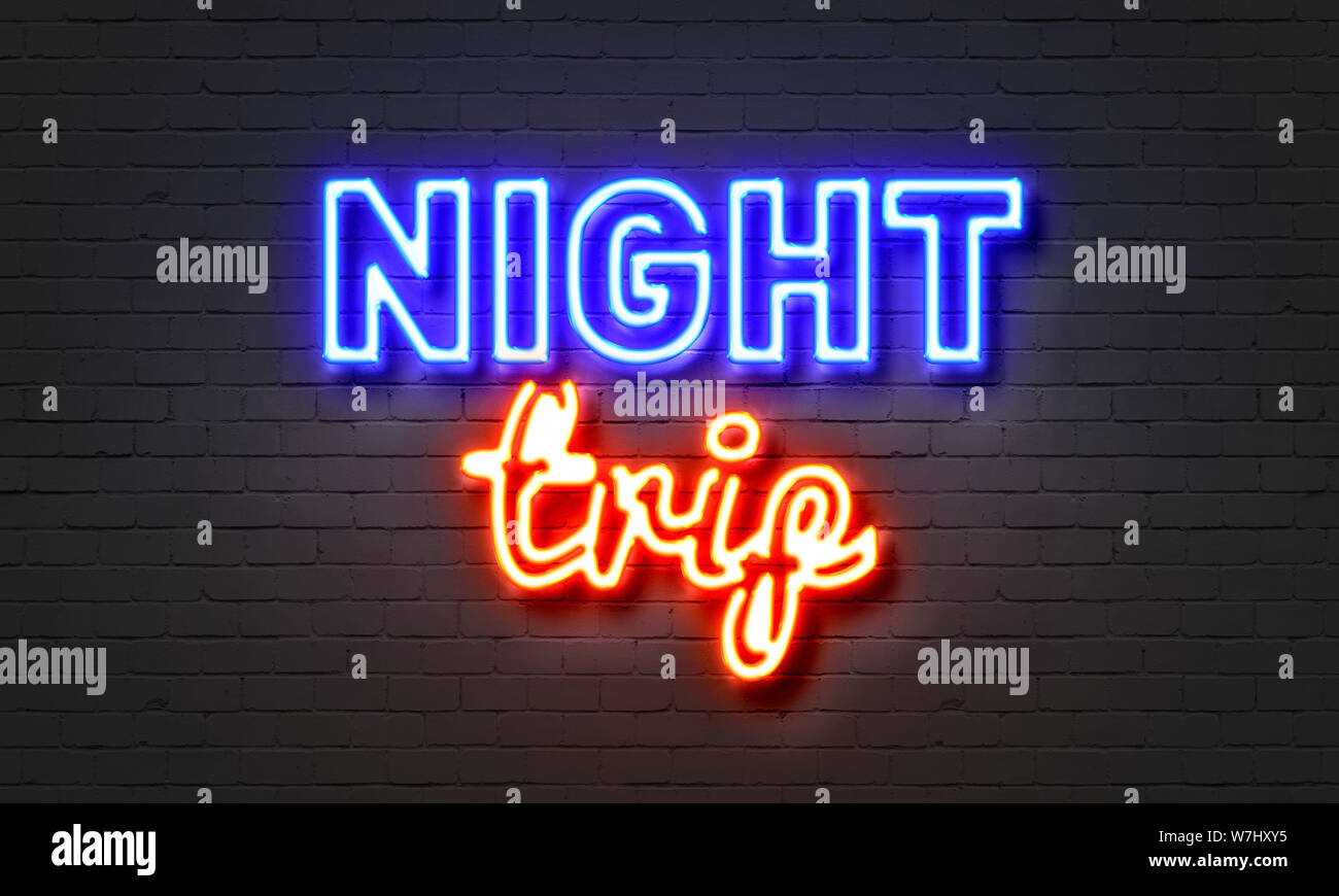 Night trip neon sign on brick wall background Stock Photo - Alamy