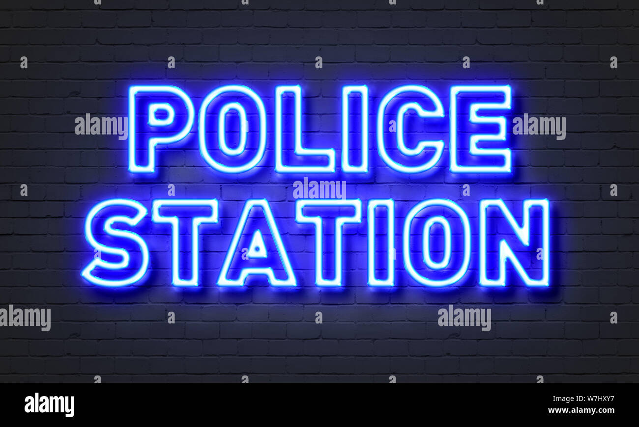Police station neon sign on brick wall background Stock Photo - Alamy