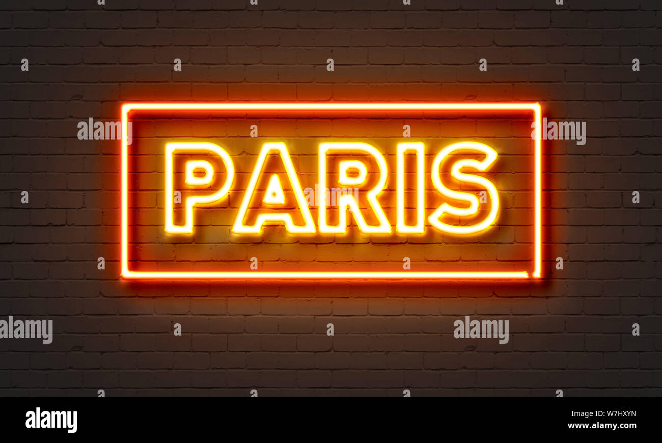 Paris neon sign on brick wall background Stock Photo - Alamy