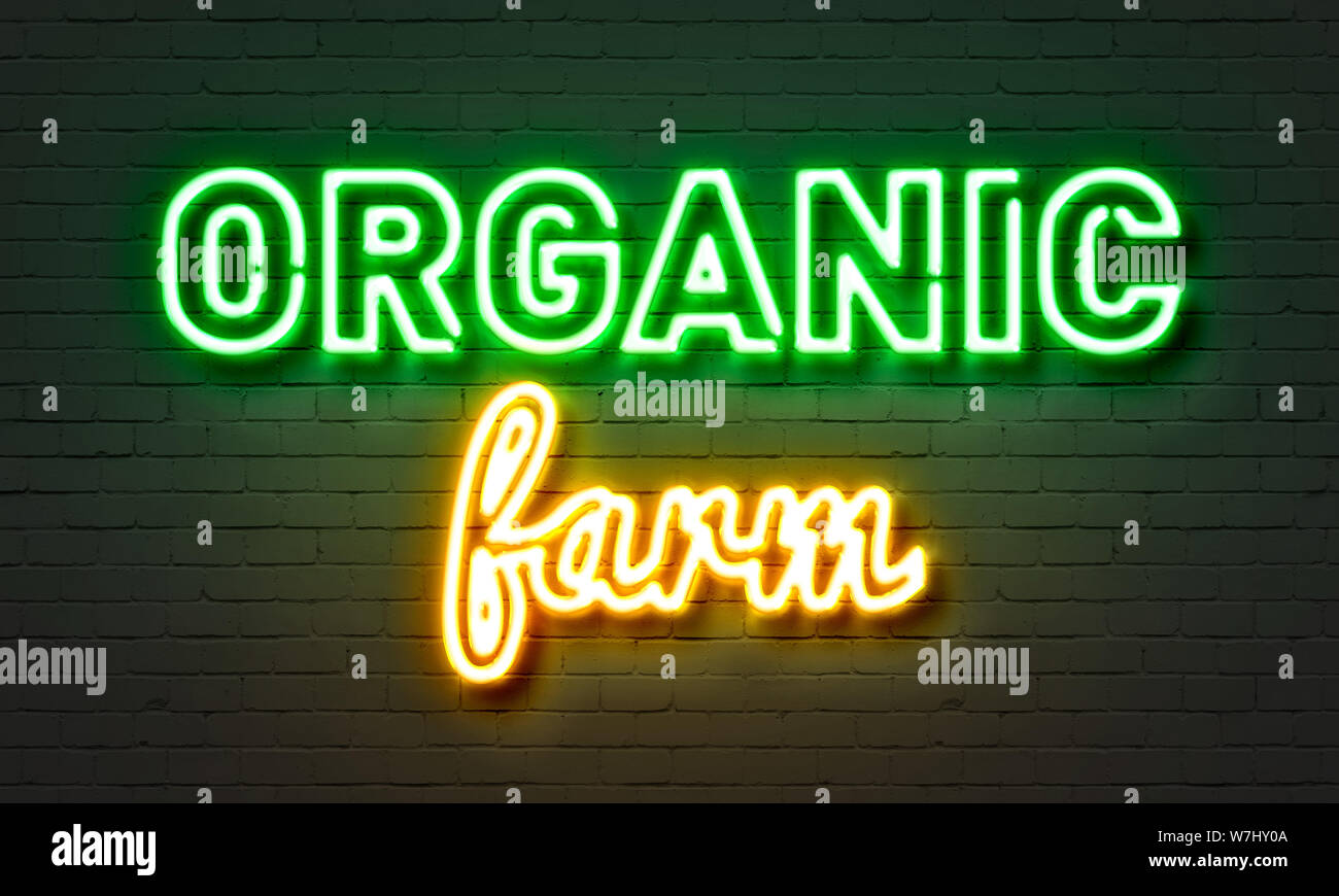 Organic food neon sign on brick wall background Stock Photo - Alamy
