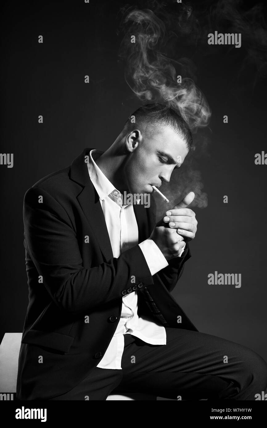 Fashion model smoking cigarette Black and White Stock Photos & Images ...