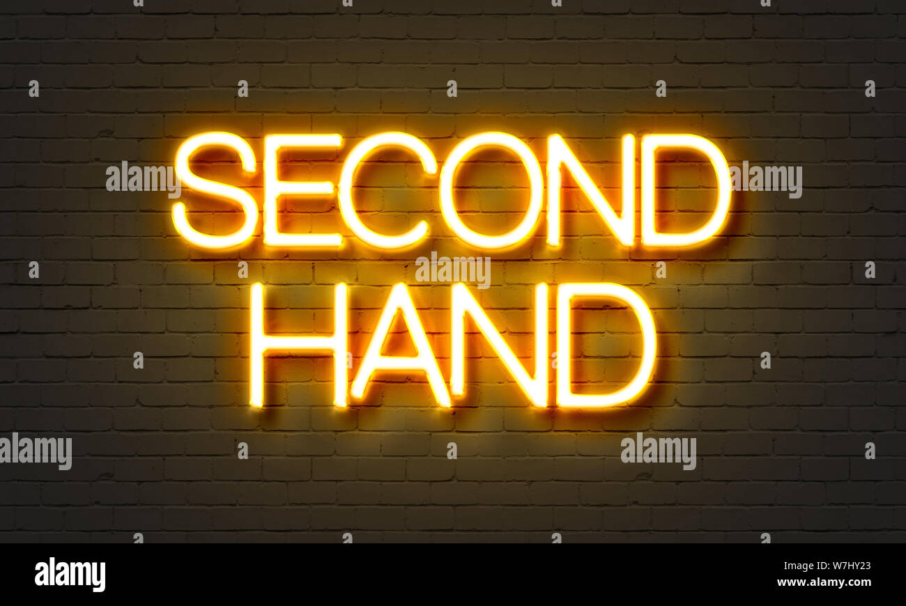 Second hand neon sign on brick wall background Stock Photo - Alamy