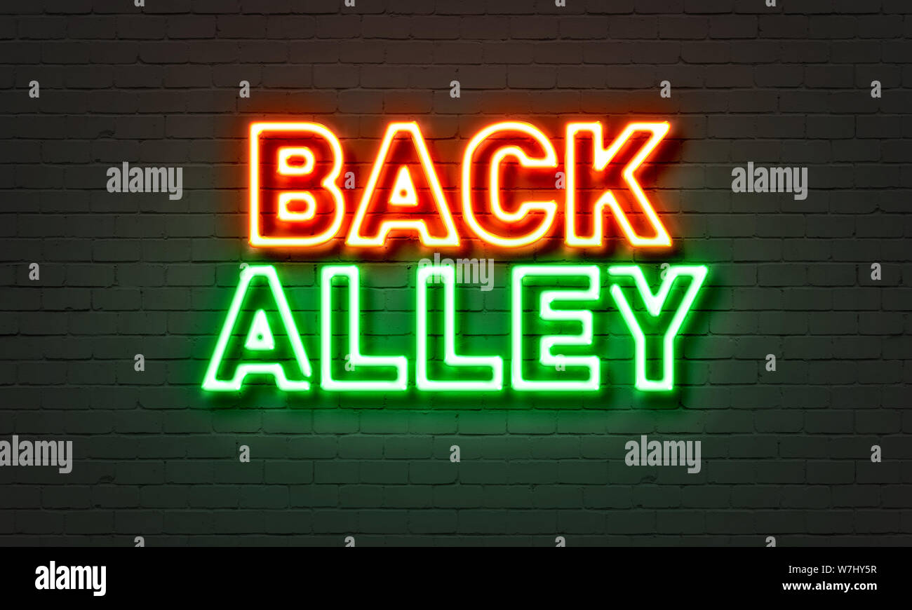Back alley neon sign on brick wall background Stock Photo - Alamy