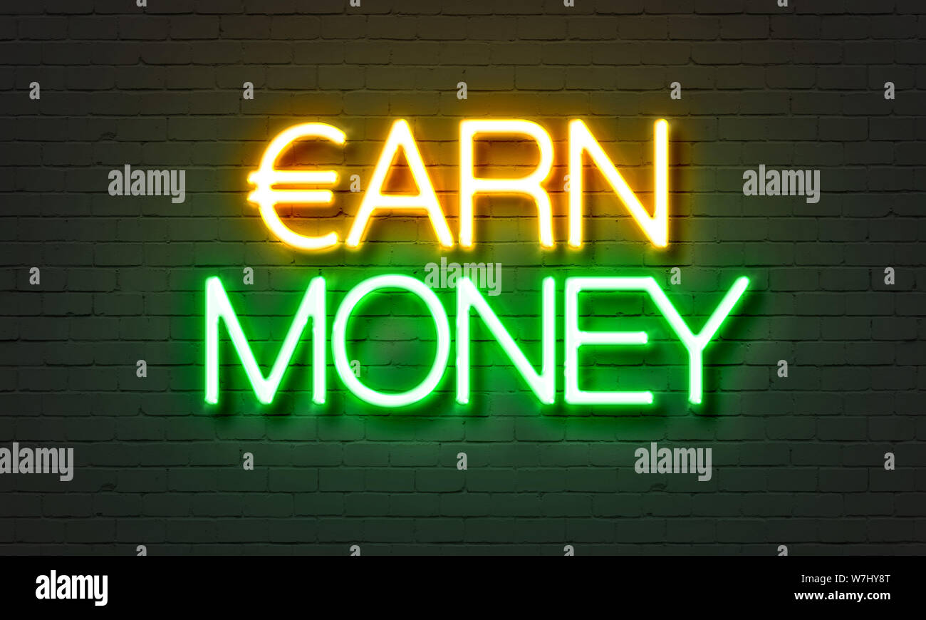 Earn money neon sign on brick wall background Stock Photo - Alamy