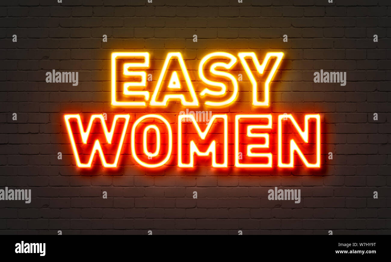 Easy women neon sign on brick wall background Stock Photo - Alamy