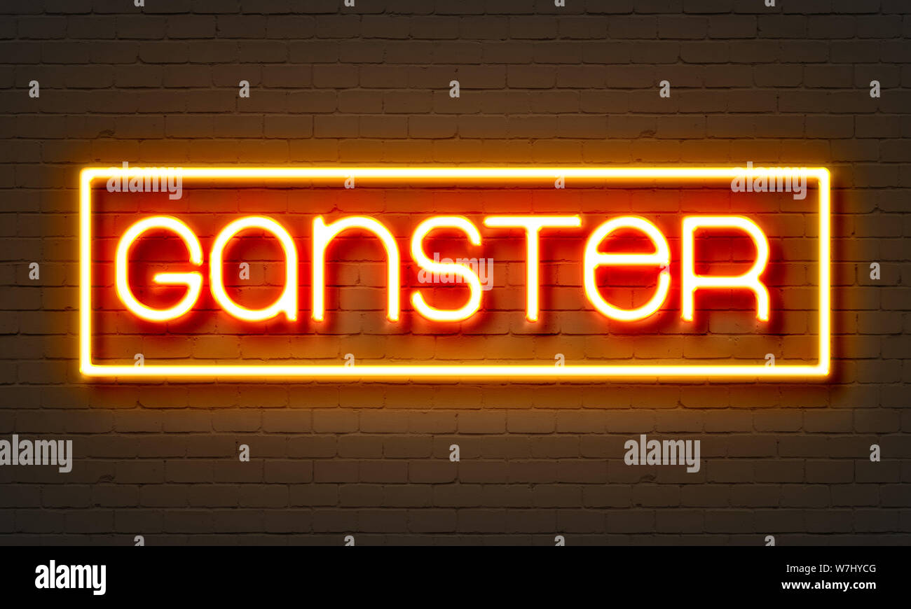 Gangster neon sign on brick wall background Stock Photo - Alamy