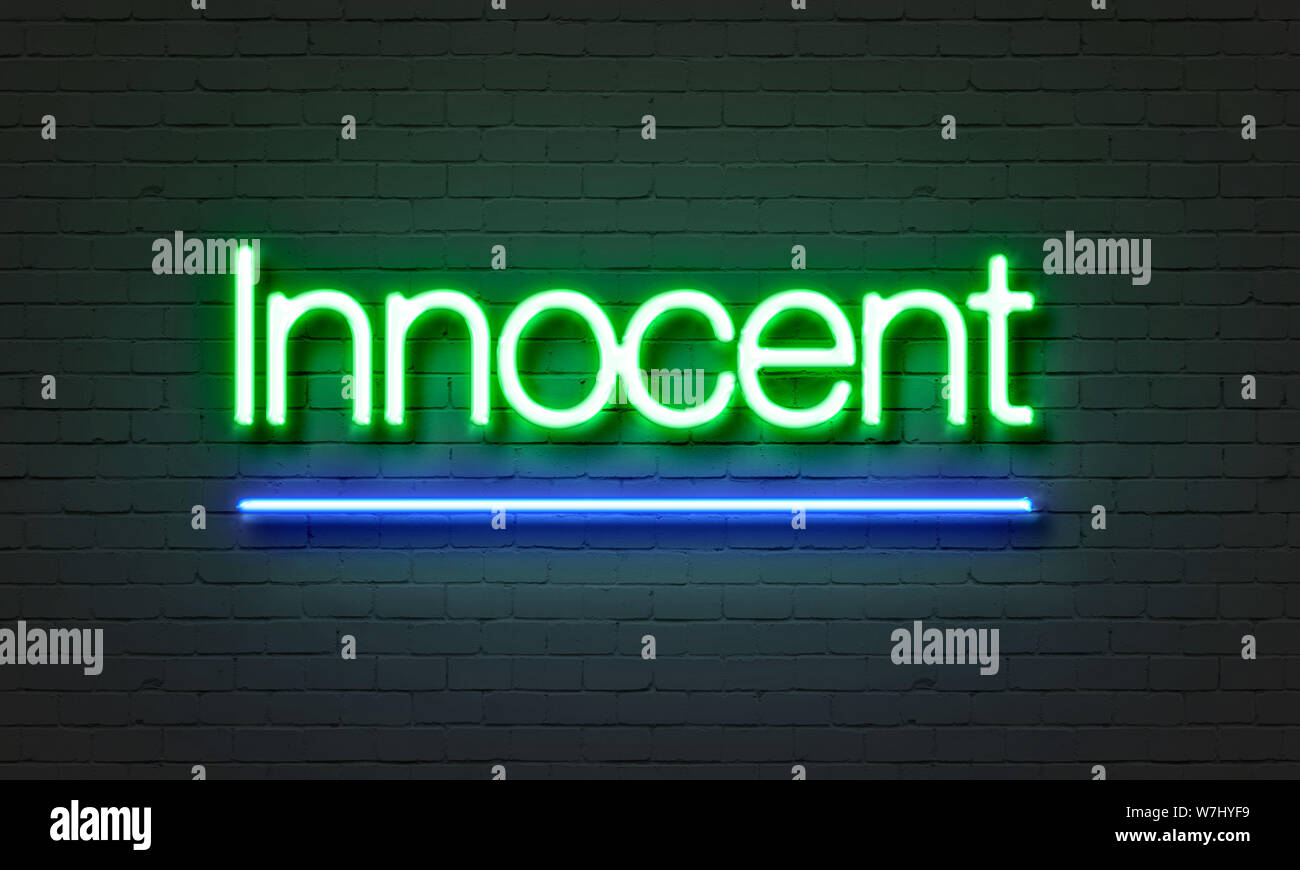 Innocent neon sign on brick wall background Stock Photo - Alamy