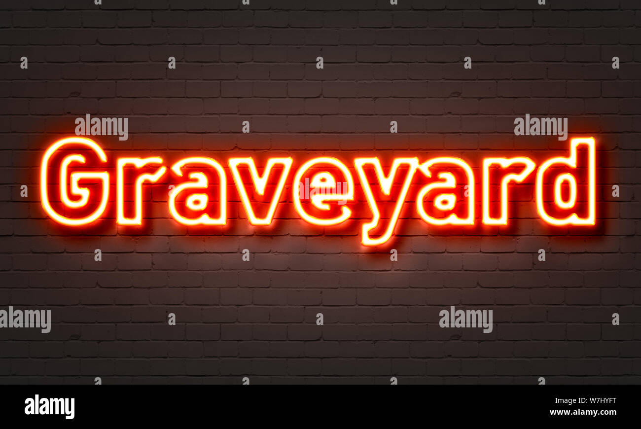 Graveyard neon sign on brick wall background Stock Photo - Alamy