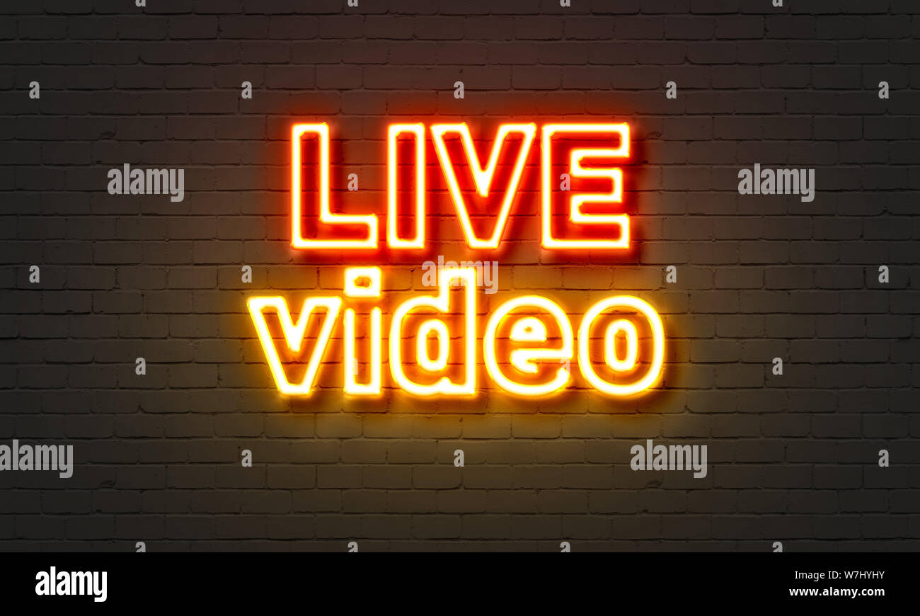 Live video neon sign on brick wall background Stock Photo - Alamy