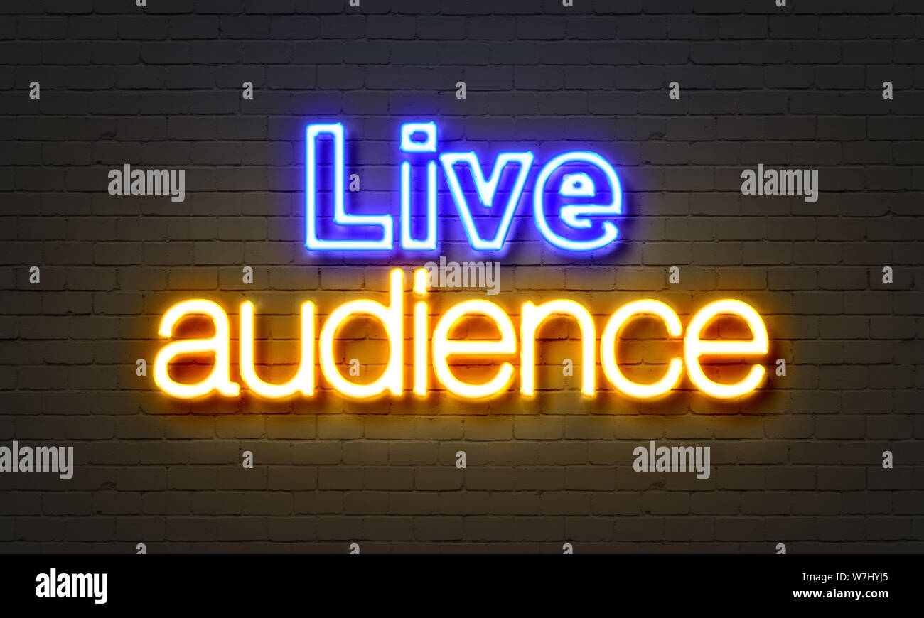 Live audience neon sign on brick wall background Stock Photo - Alamy