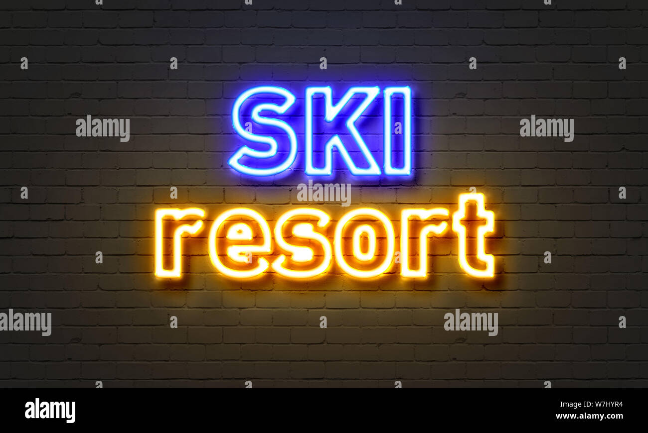 Ski resort neon sign on brick wall background Stock Photo - Alamy