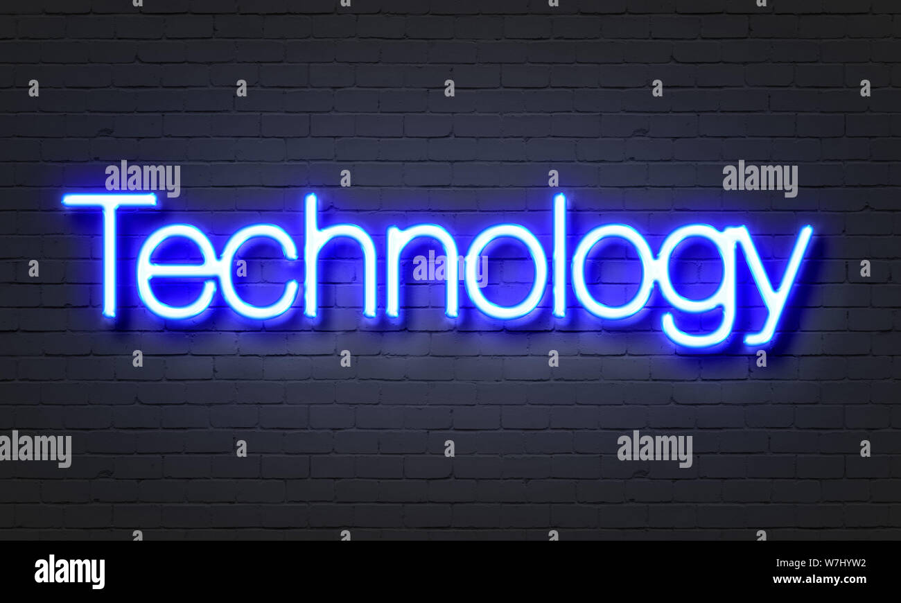 Technology neon sign on brick wall background Stock Photo - Alamy